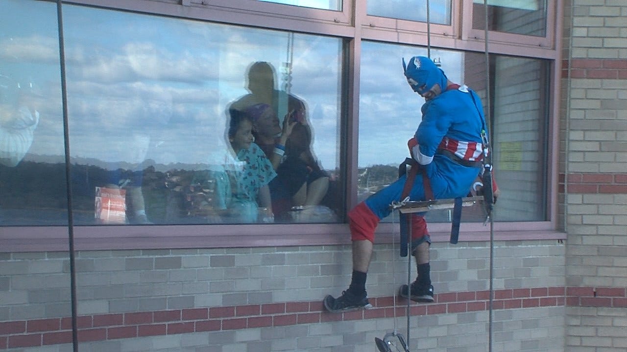 Superhero window washers at Hasbro Children's Hospital