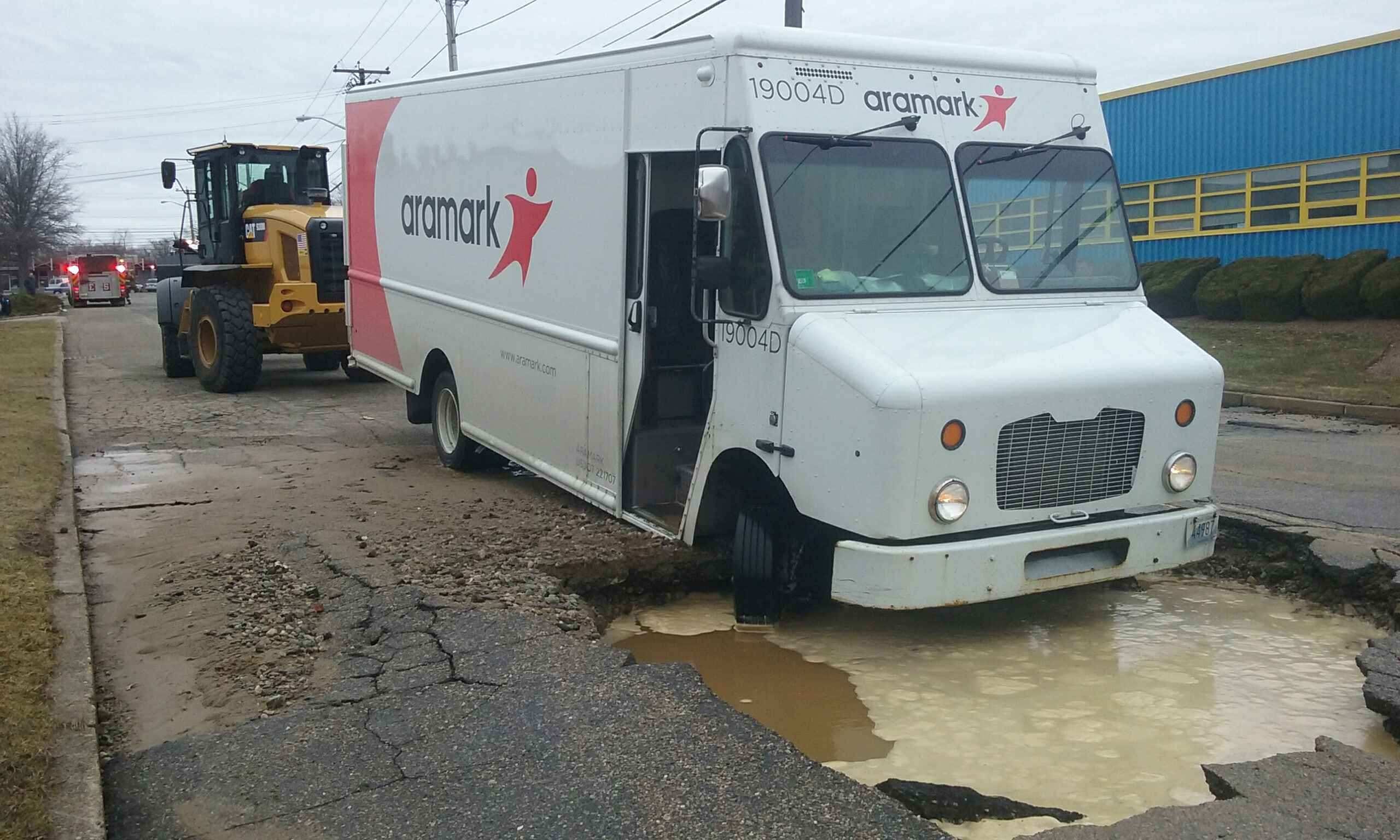 Water main break in East Providence, delivery truck sinks throug