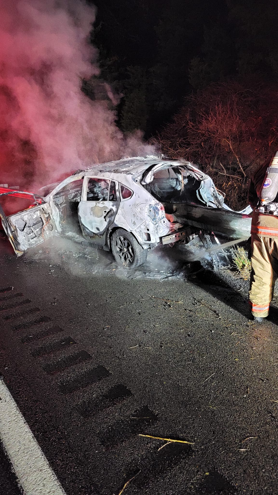 Car bursts into flames after being impaled by guard rail in East ...