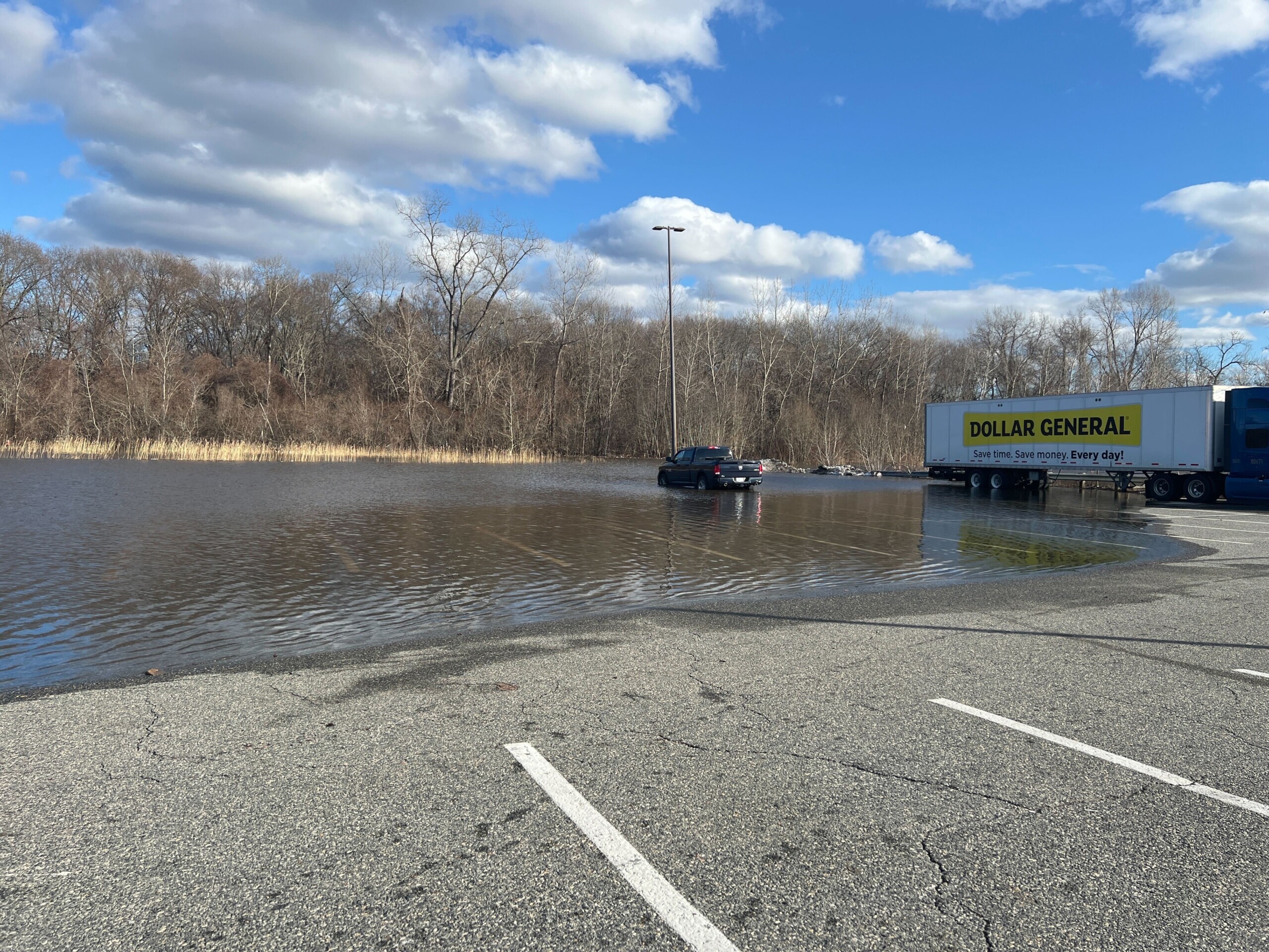 Clean-up crews work to pump out flooding water in Warwick shopping ...