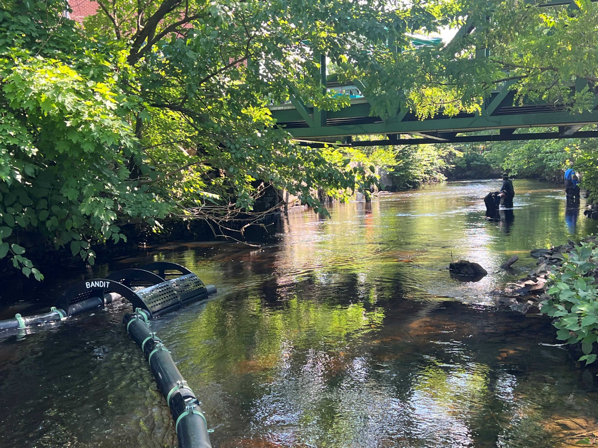 Woonasquatucket River Watershed Council, Cox install litter trap | ABC6