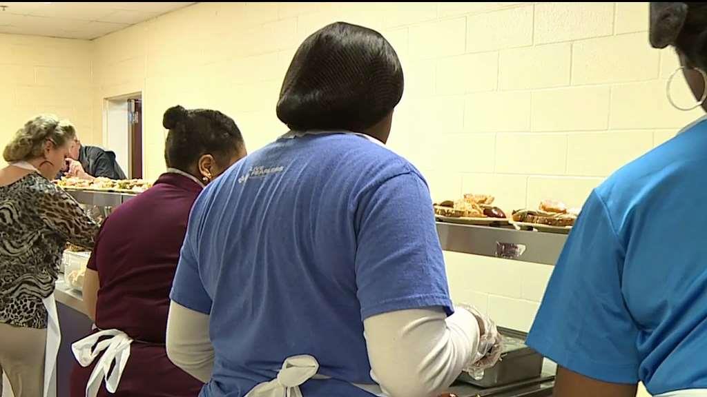 Blue Cross Blue Shield employees lend a helping to serve meals at local ...