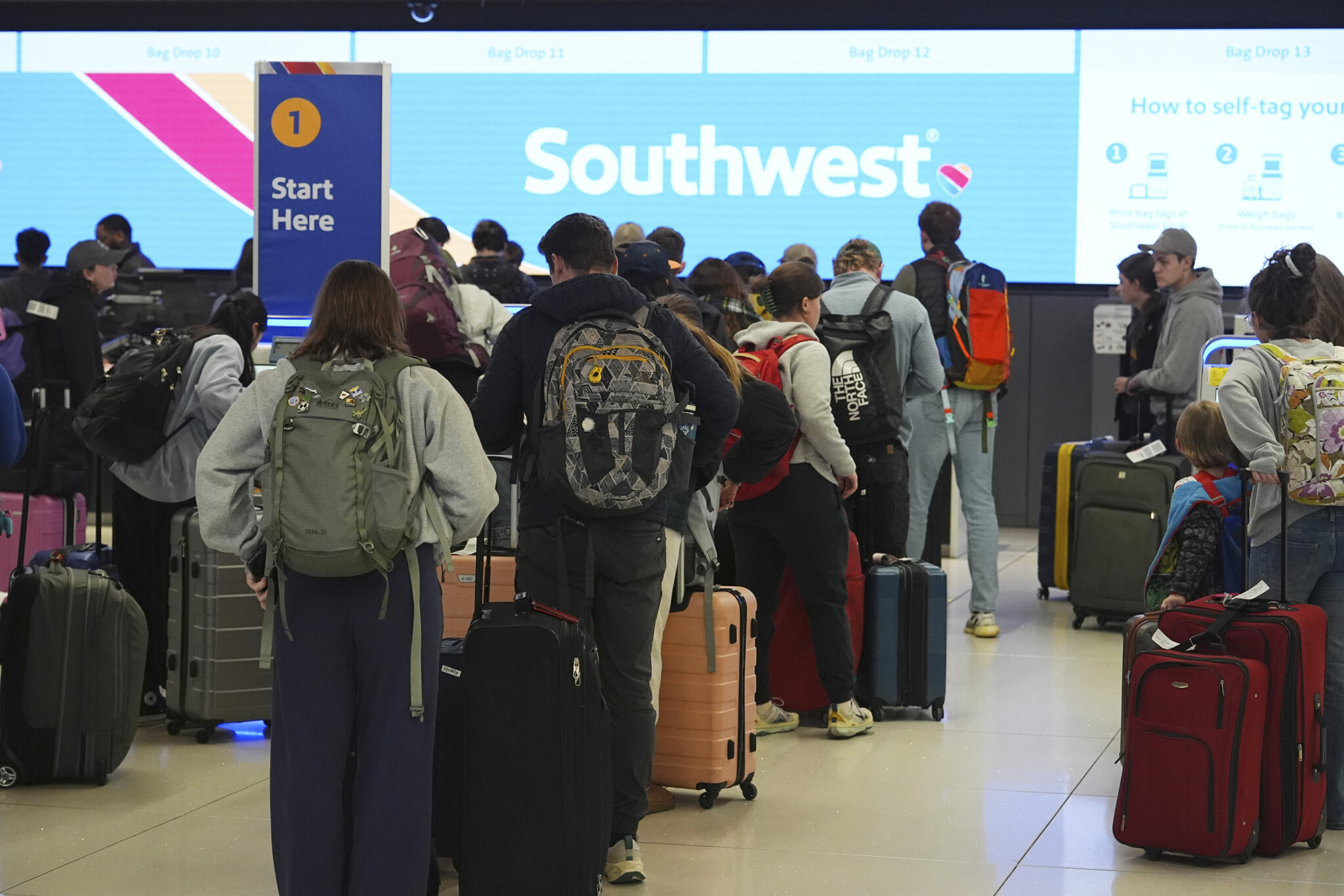 Southwest Airlines breaks with another tradition and checked bags will ...