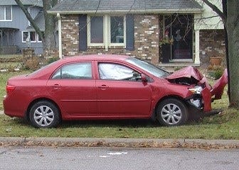 Man drives car into mailbox, light pole and tree