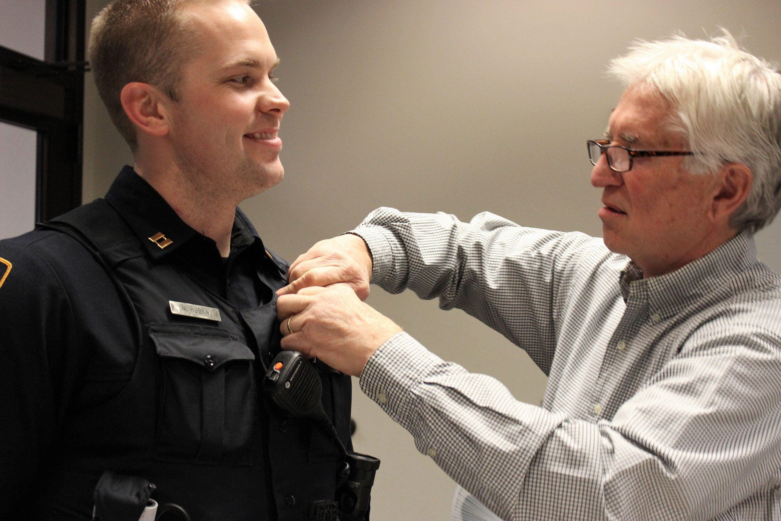 LPD Captain celebrates promotion with retired police officer father