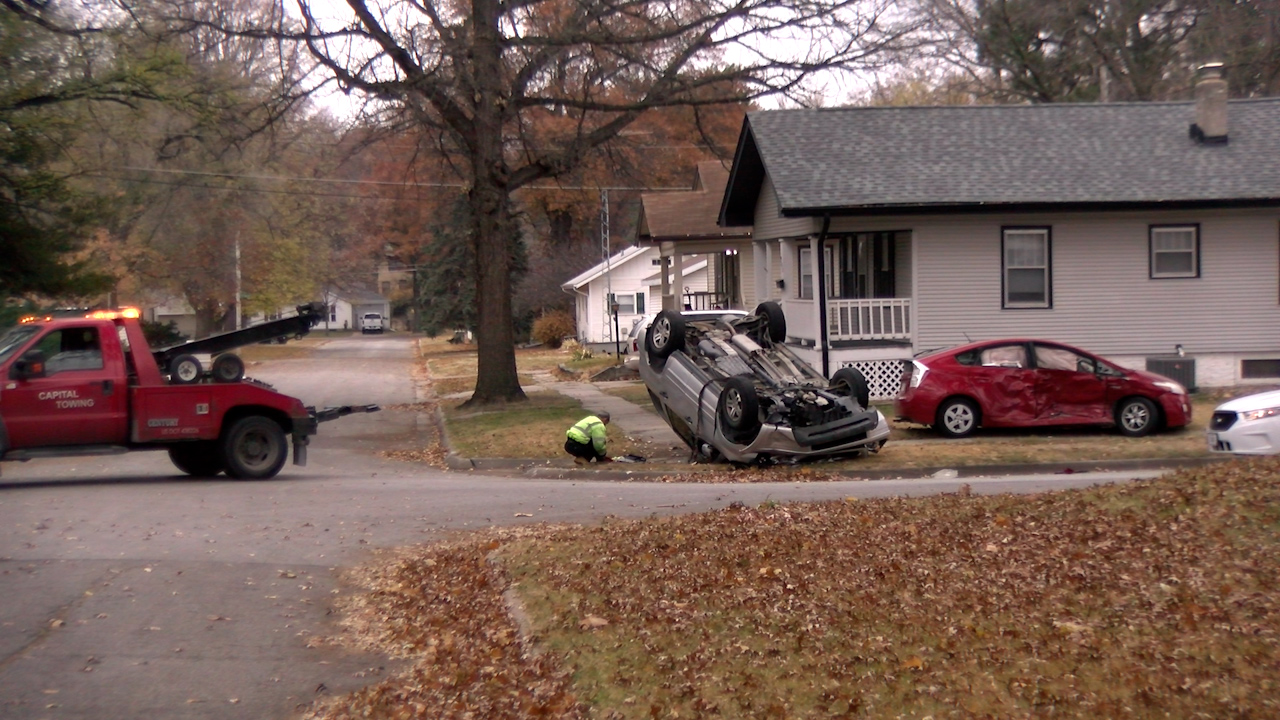 Two vehicle rollover crash comes dangerously close to hitting Lincoln home
