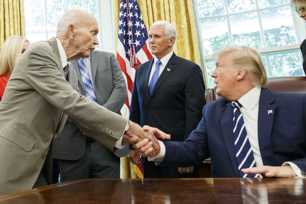 President Donald Trump shakes hands with Apollo 11 astronaut Michael ...
