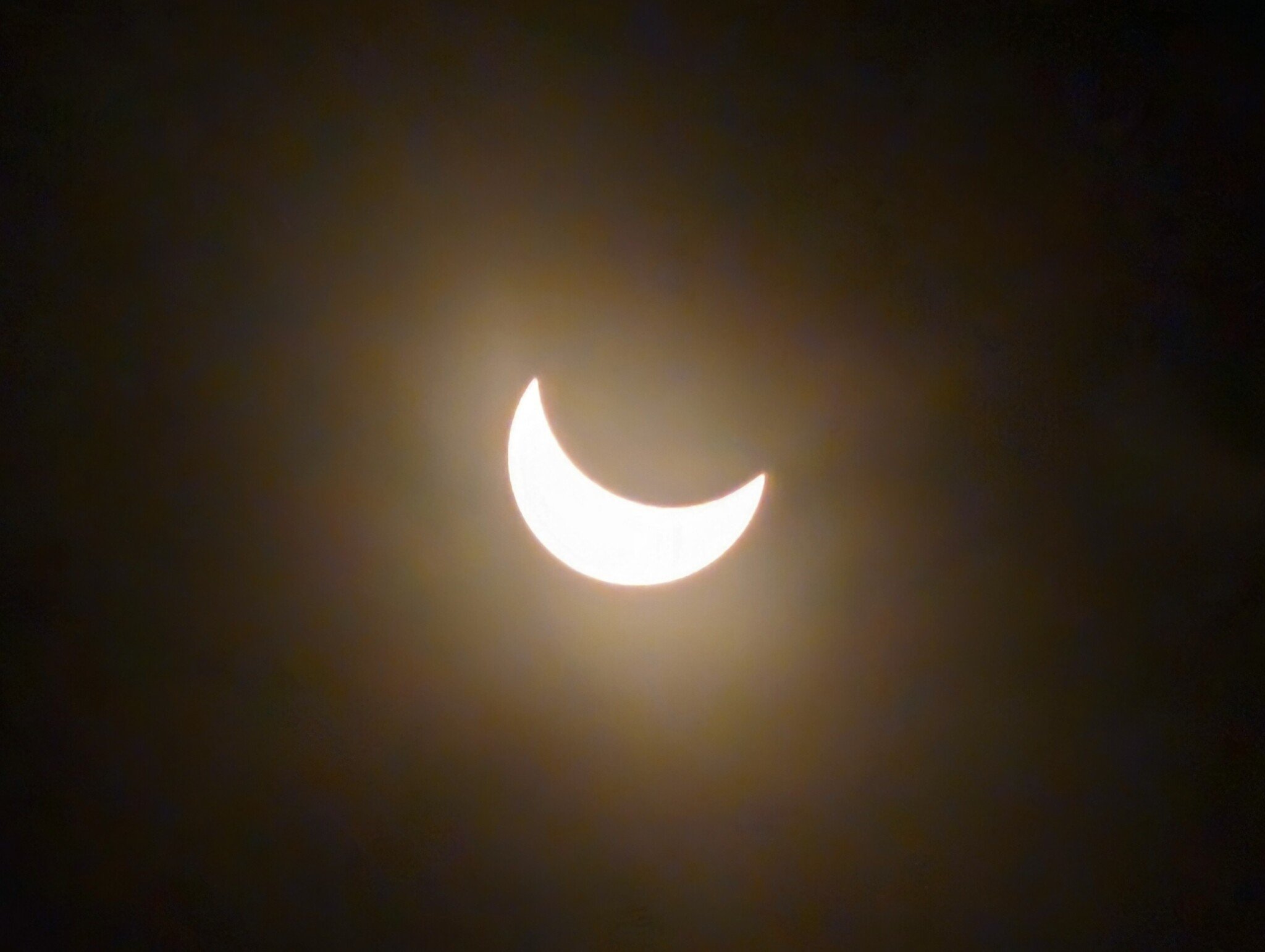 A Total Solar Eclipse Races Across North America As Clouds Part Along ...