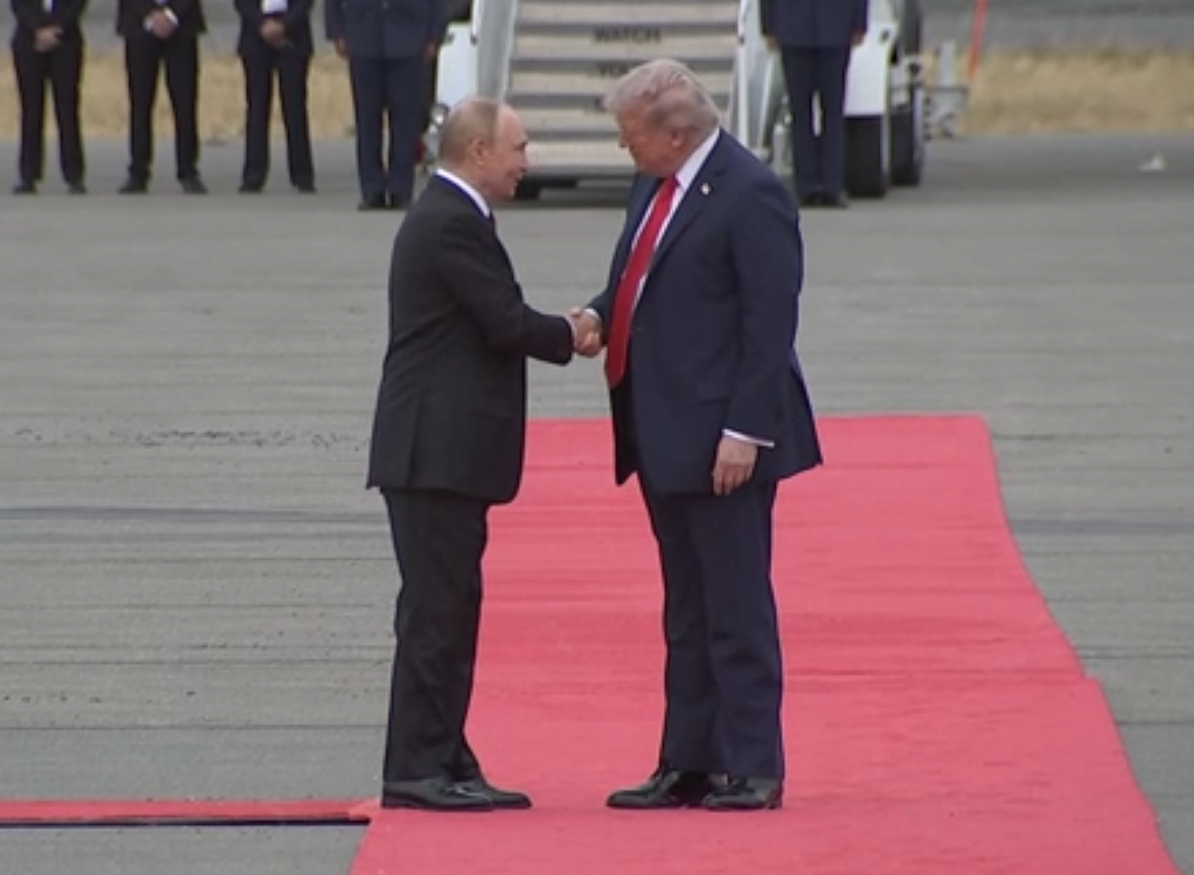Trump and Putin shake hands in Alaska before their summit on the war in ...