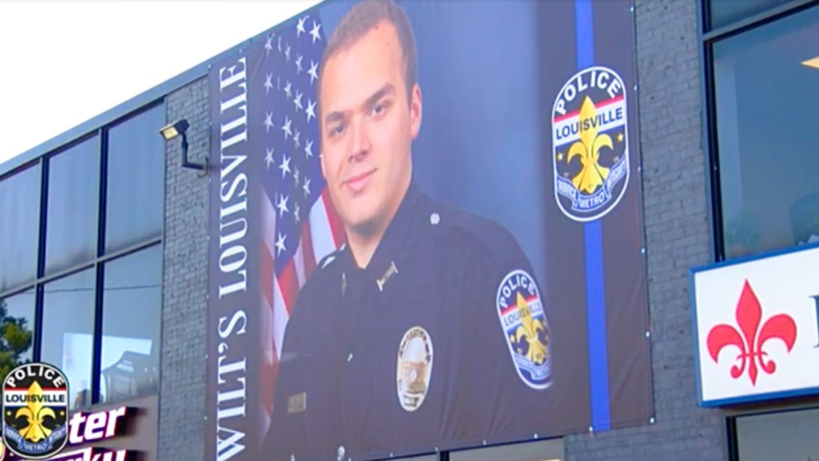Banner placed on building facing I-64 honors LMPD officer Nickolas Wilt