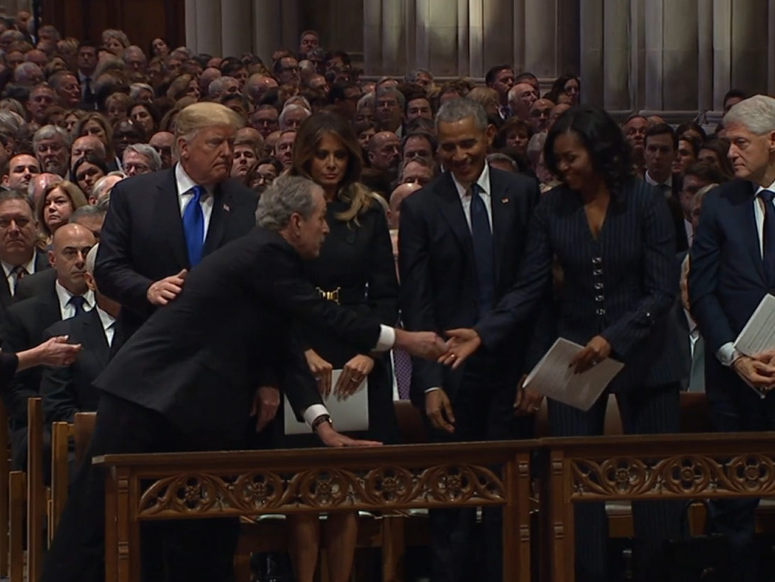 George W. Bush appears to slip Michelle Obama candy at father's funeral ...