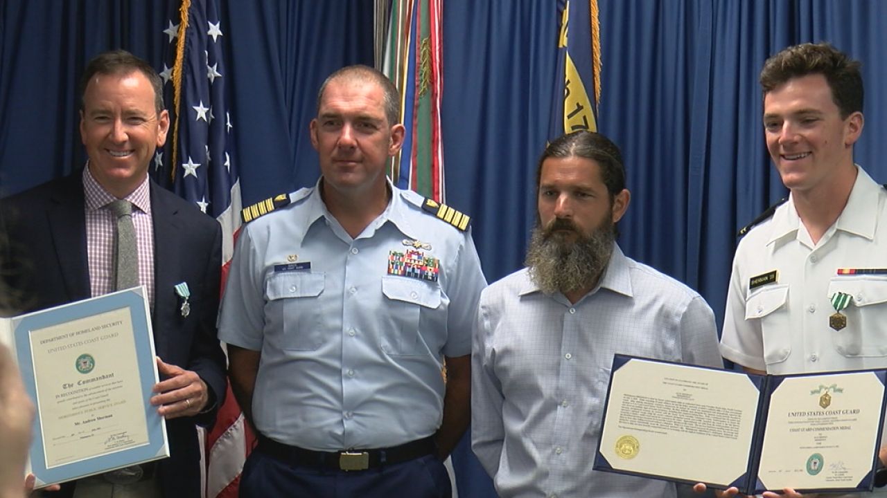 Father and son receive awards from the North Carolina Coast Guard after ...