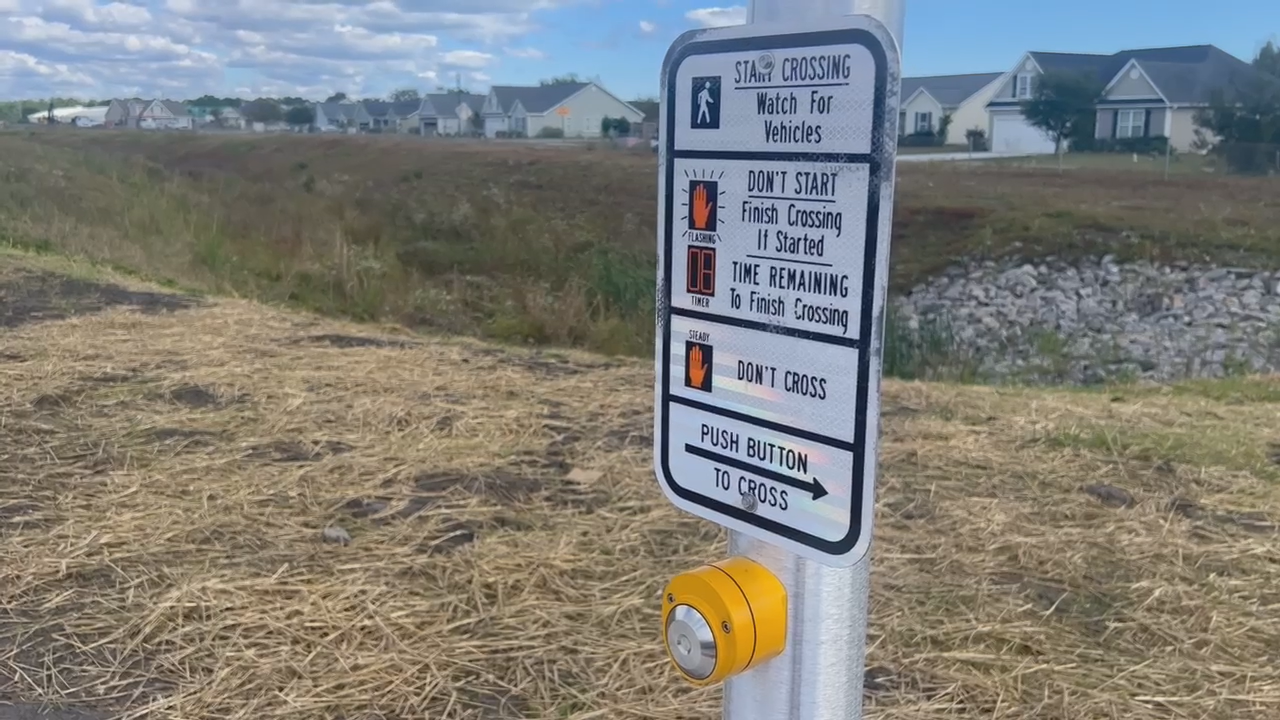 NCDOT installs traffic signal signs along Military Cutoff Rd. Extension ...